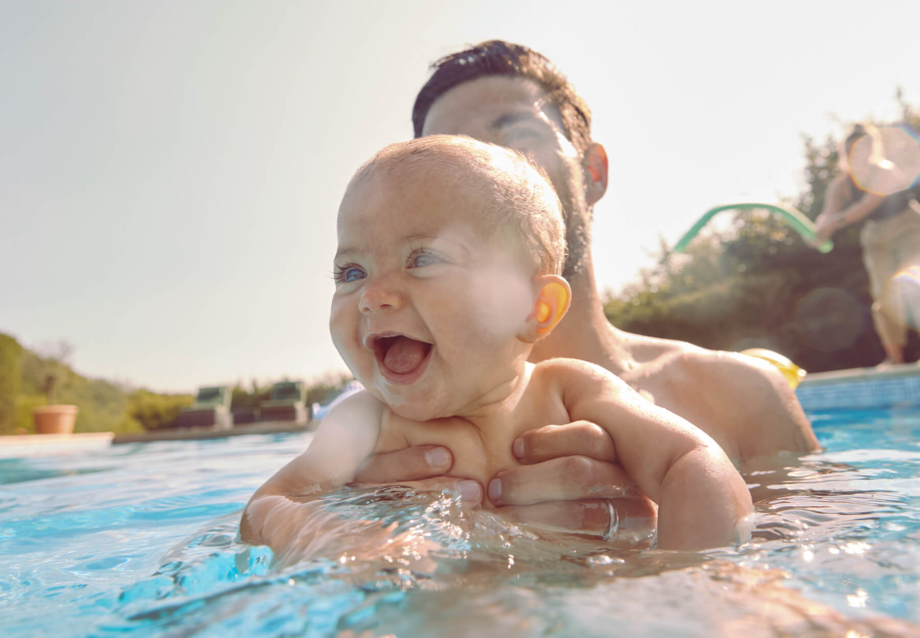 The Splashing Benefits of Infant Swim Lessons - Tiny Traveler